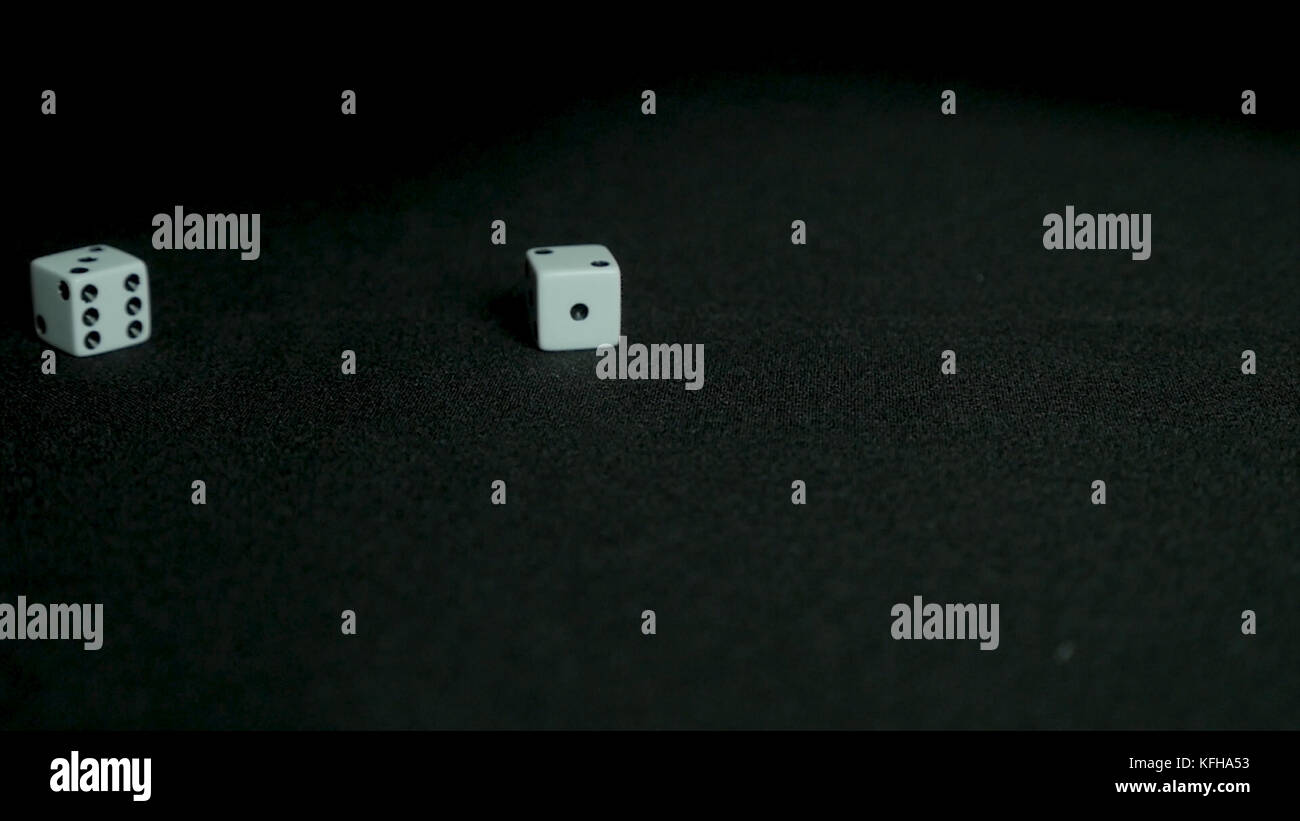 Detail of dice on black table. Dice throw on the table. Close up Stock ...