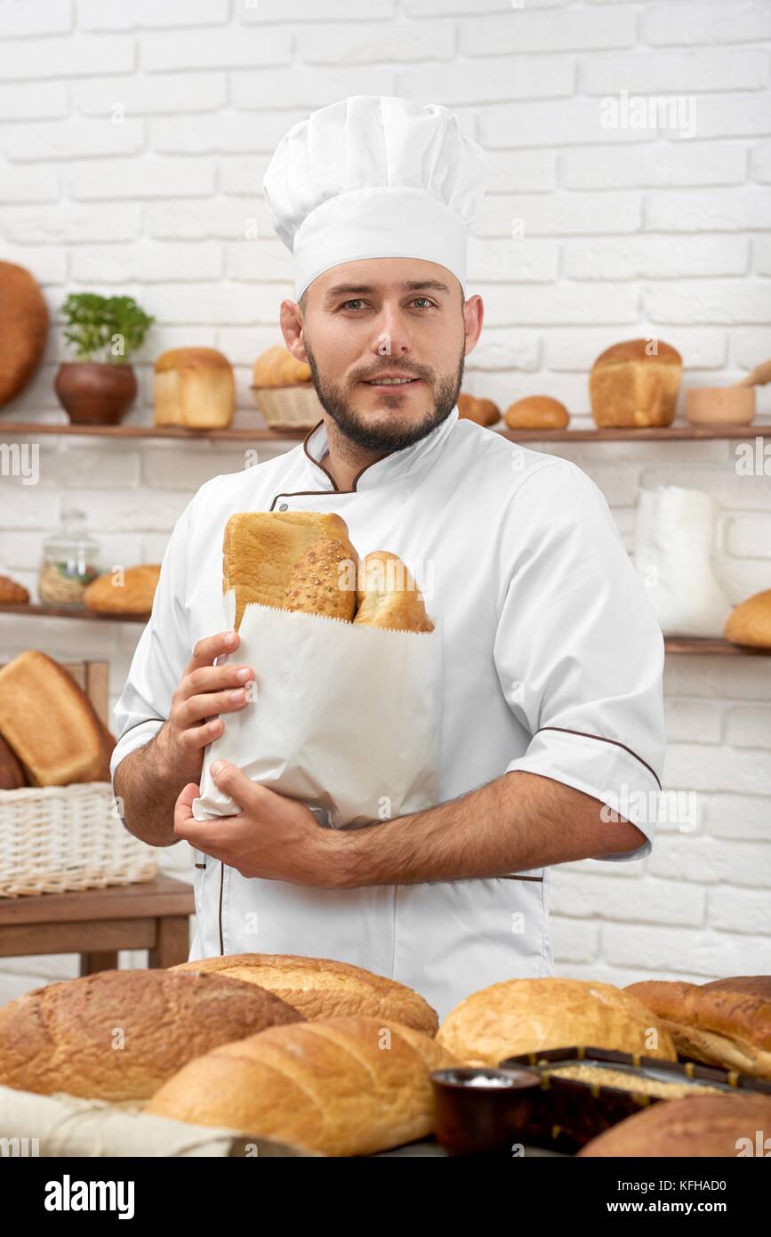 Young man working at his bakery Stock Photo - Alamy