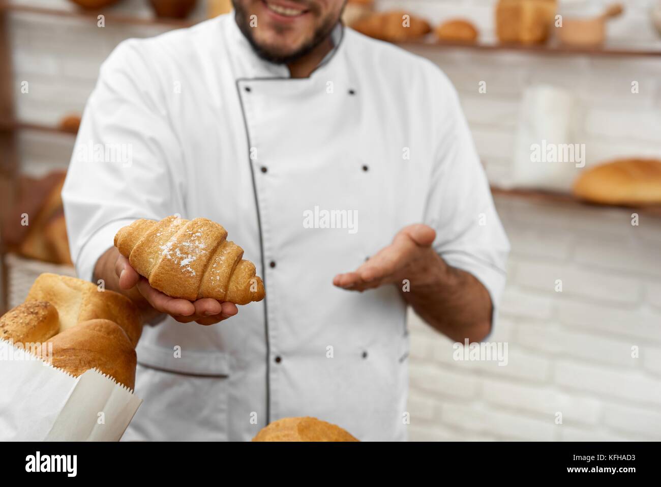 Young man working at his bakery Stock Photo - Alamy