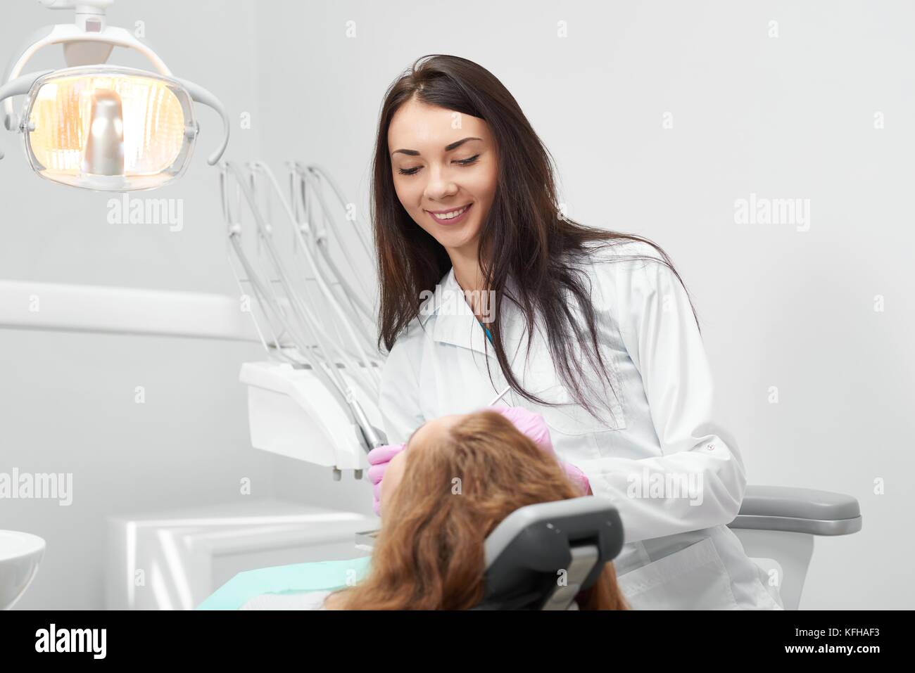 Professional female dentist at work Stock Photo - Alamy