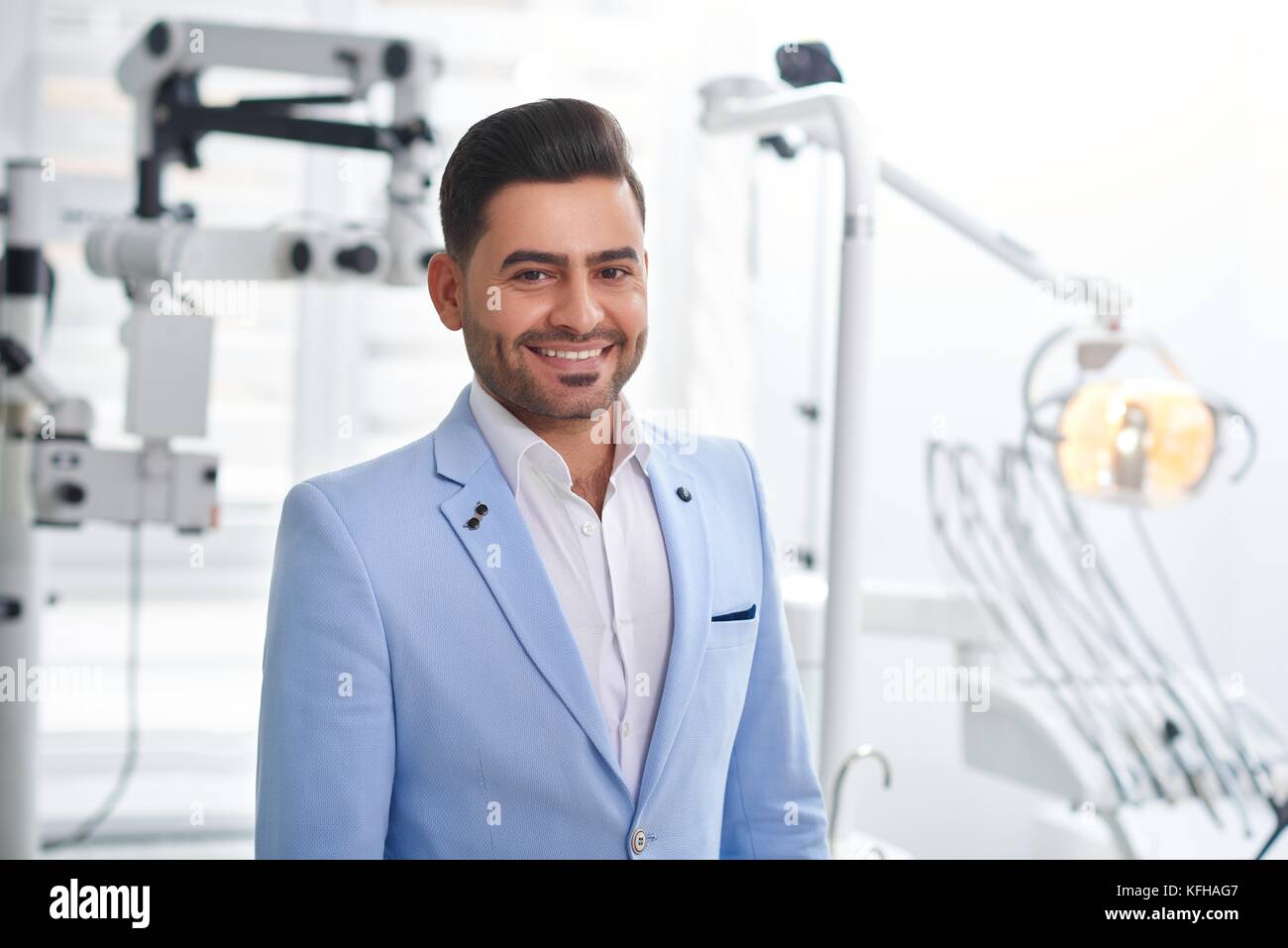 Young man visiting dentist Stock Photo - Alamy