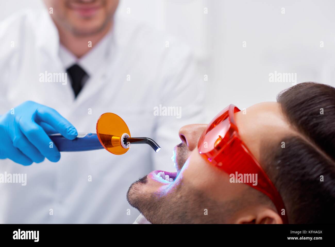 Young man visiting dentist Stock Photo - Alamy