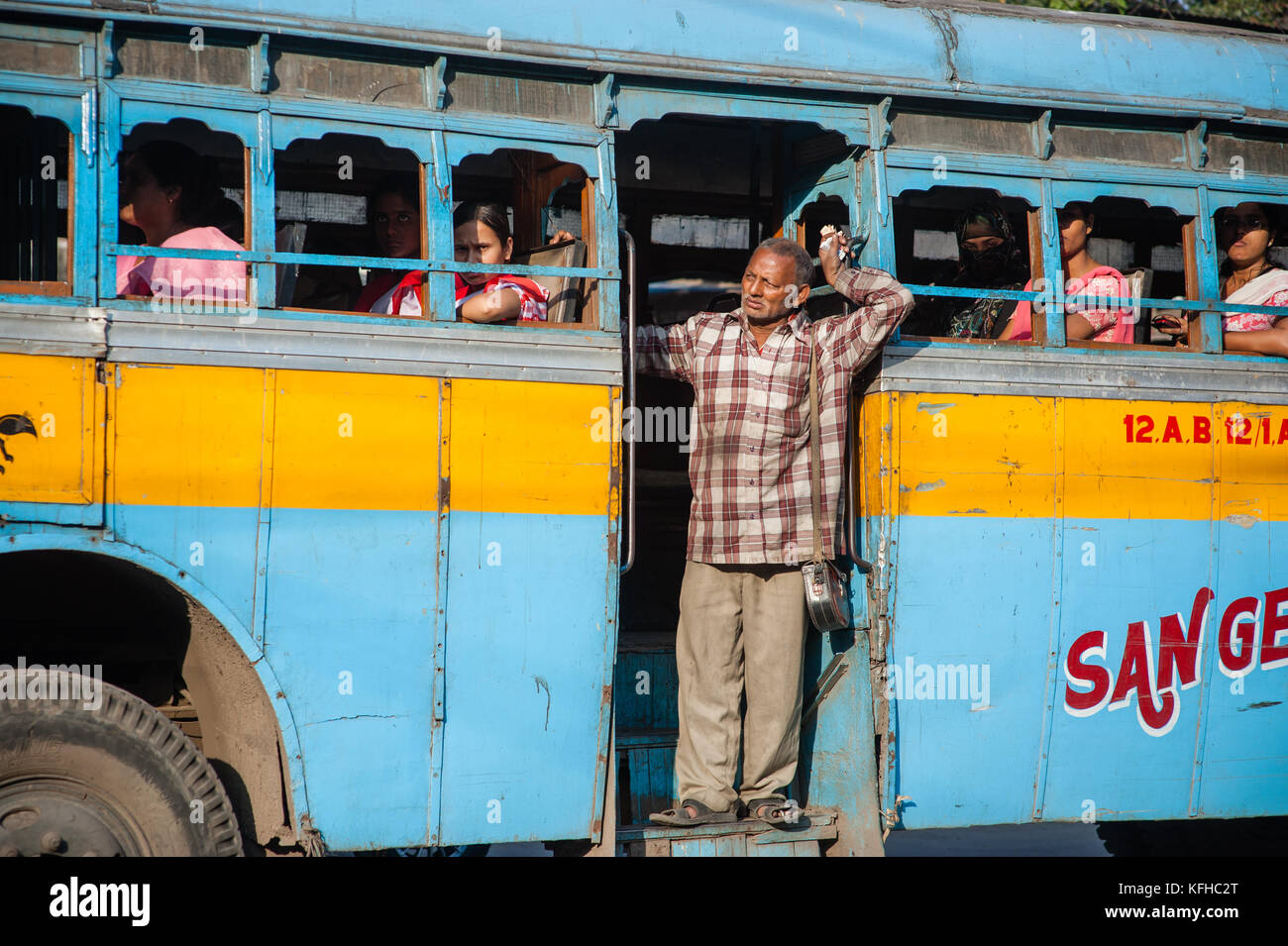Man traveling on city bus Stock Photo - Alamy