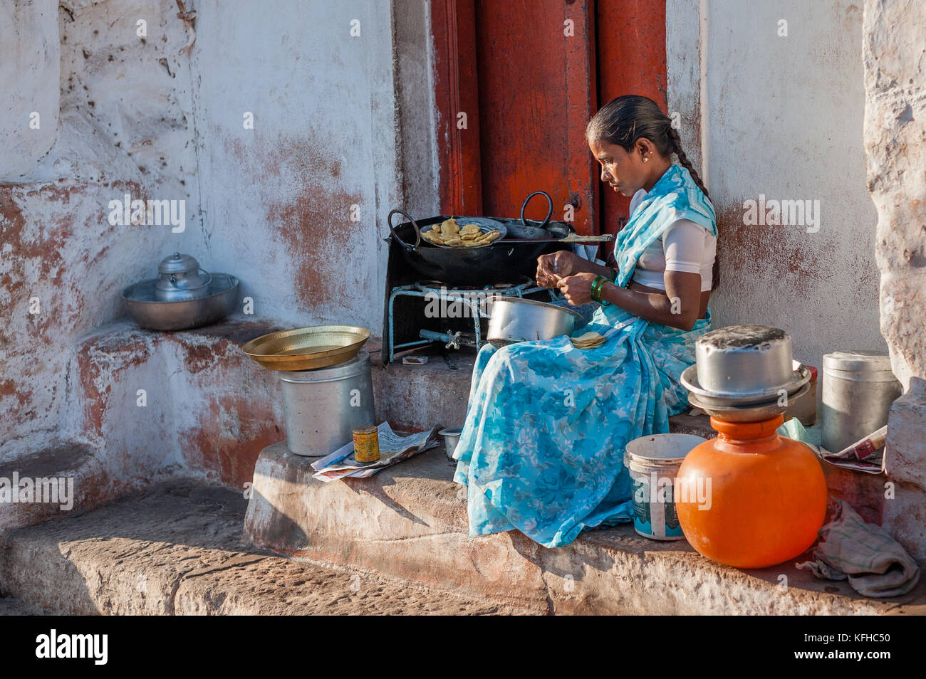 Indian Woman Cooking Outside House Stock Photo - Alamy