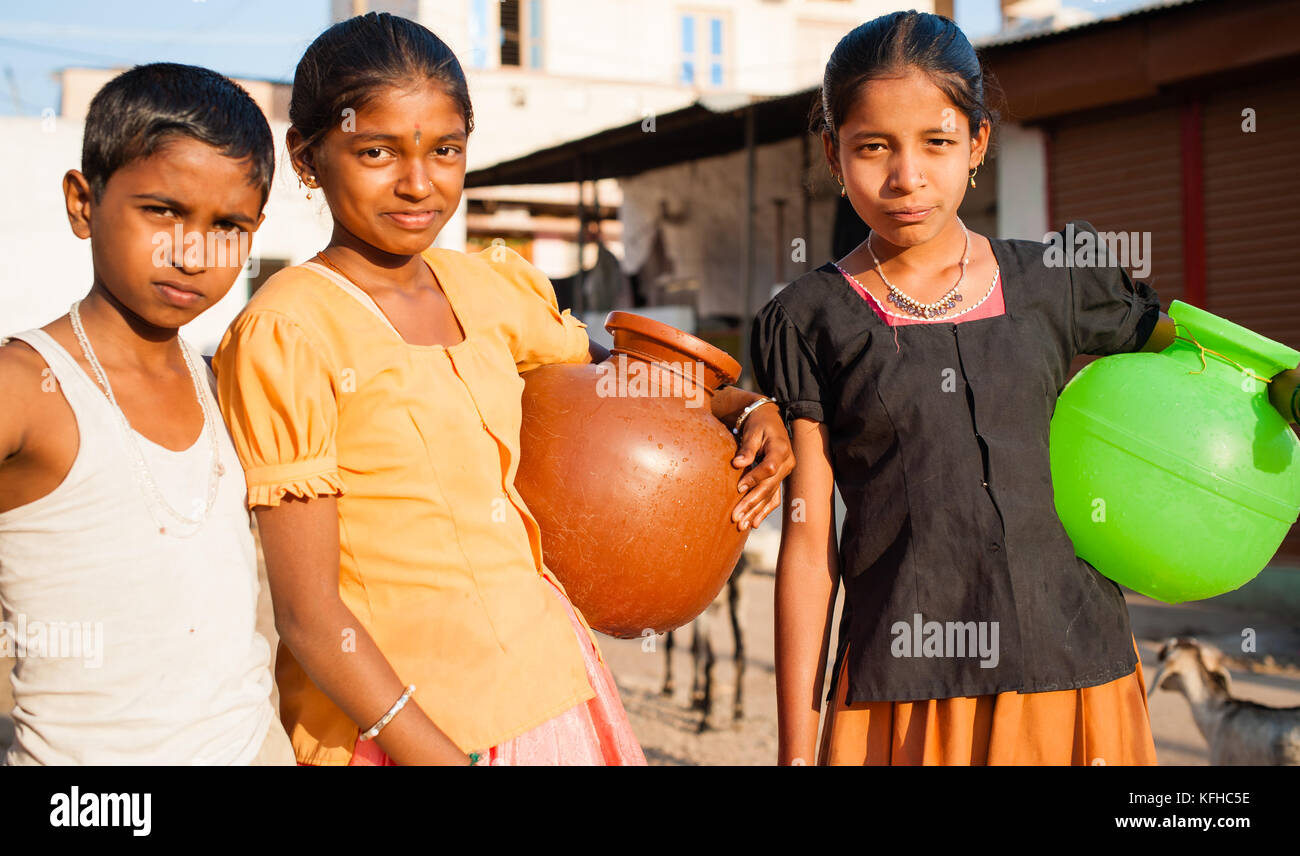 Indian Kids Going for Water Stock Photo - Alamy