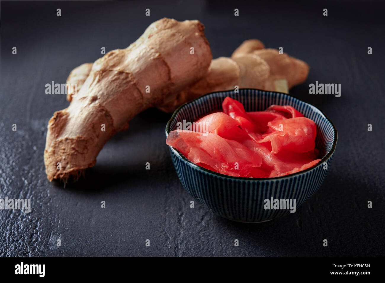 pickled ginger and fresh root ginger on dark background Stock Photo - Alamy