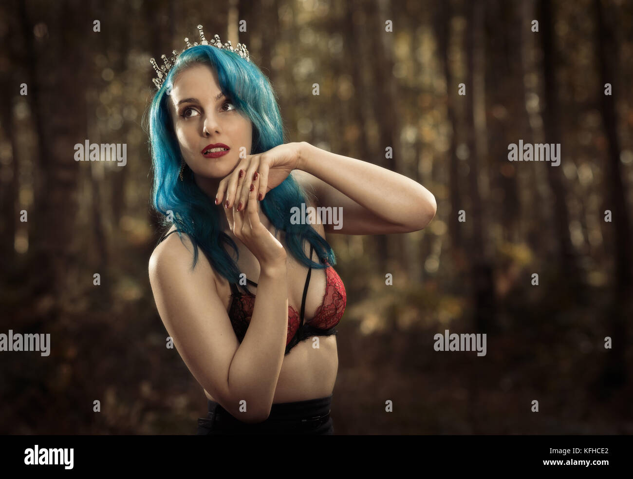 Woman wearing a regal crown in woodland, England, UK Stock Photo - Alamy