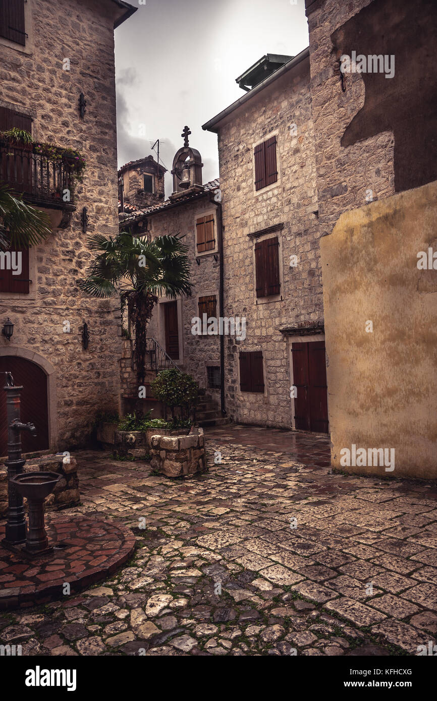 Medieval vintage street with old buildings with wooden shutters and ...