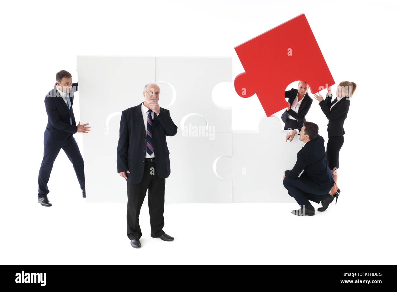Business team assembling big puzzle isolated on white background Stock ...
