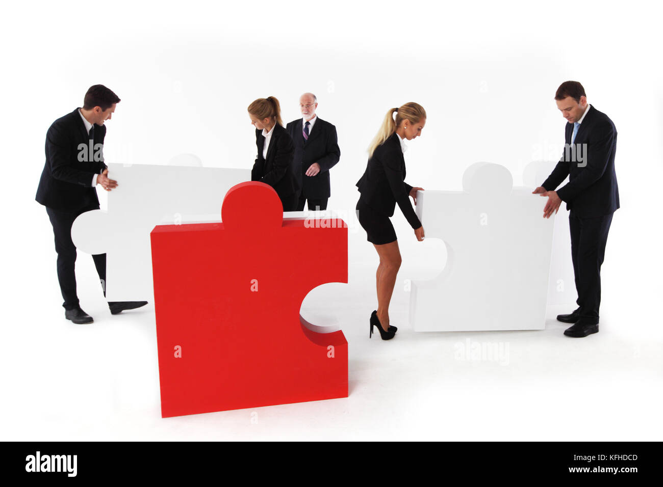 Business team assembling big puzzle isolated on white background Stock ...
