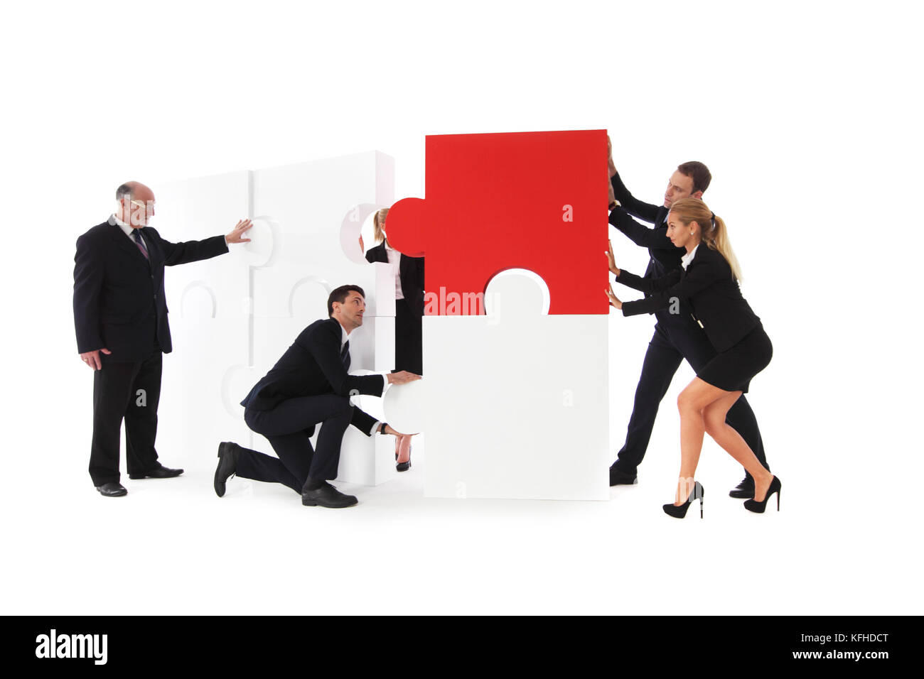 Business team assembling big puzzle isolated on white background Stock ...