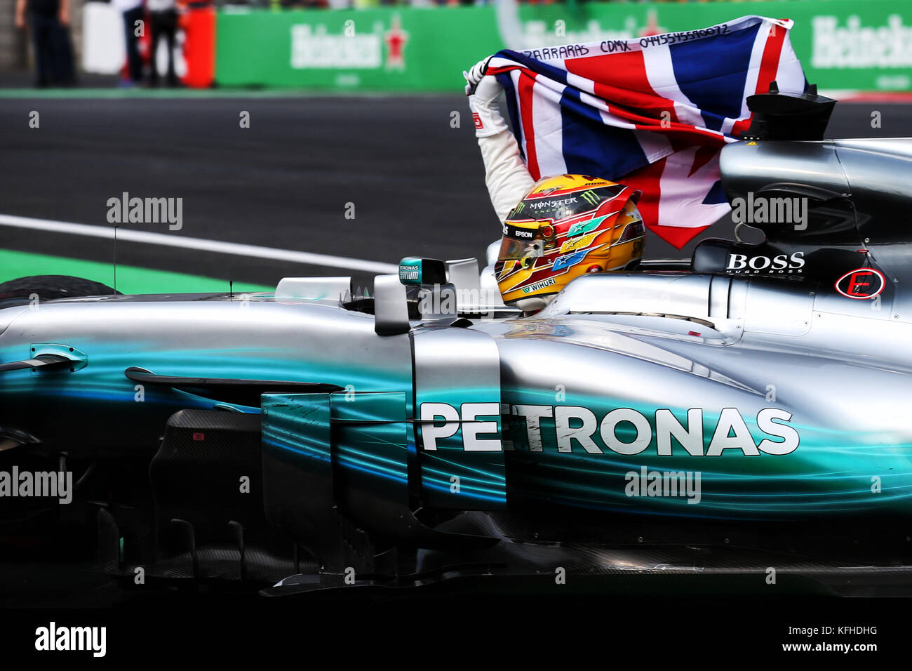 Mercedes' Lewis Hamilton celebrates winning the Formula One drivers ...