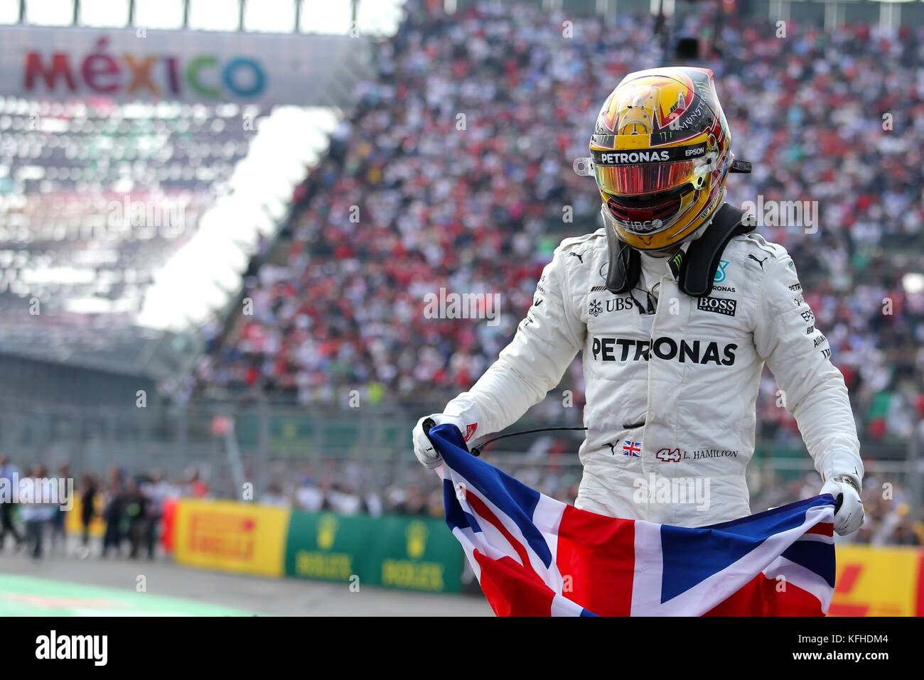 Mercedes' Lewis Hamilton celebrates winning the Formula One drivers ...
