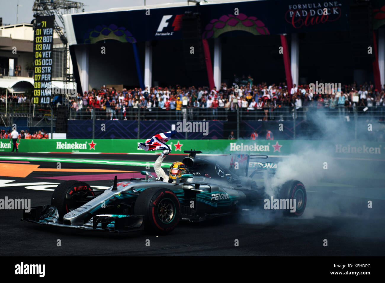 Mercedes' Lewis Hamilton celebrates winning the Formula One drivers ...