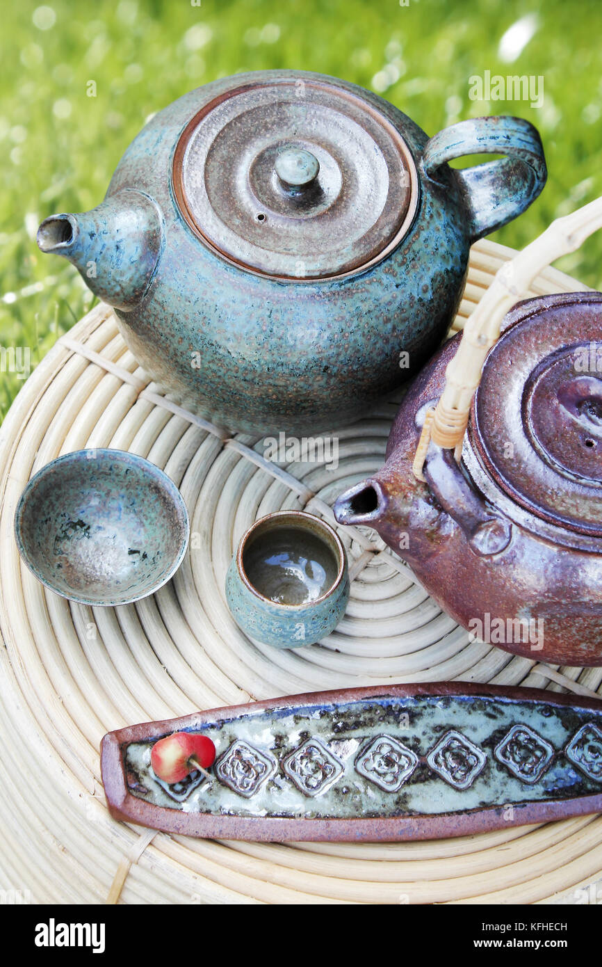 Tradition oriental ceramic tea pots at a garden Stock Photo - Alamy