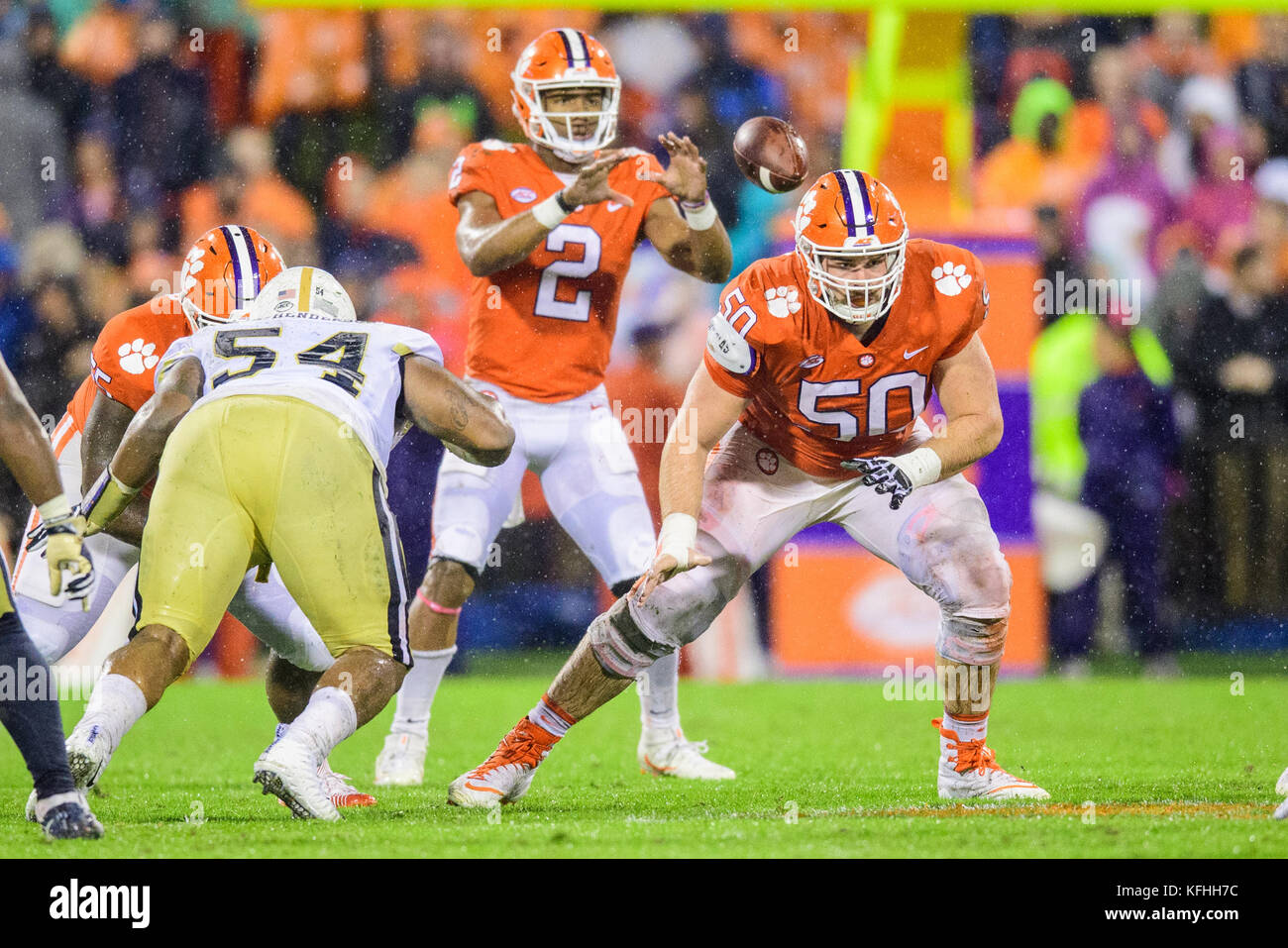 Clemson center Justin Falcinelli (50) and Clemson quarterback Kelly ...