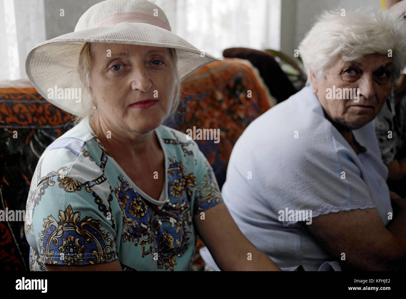 Torez, Ukraine. 19th Aug, 2015. Old ladies seen waiting for a free ...