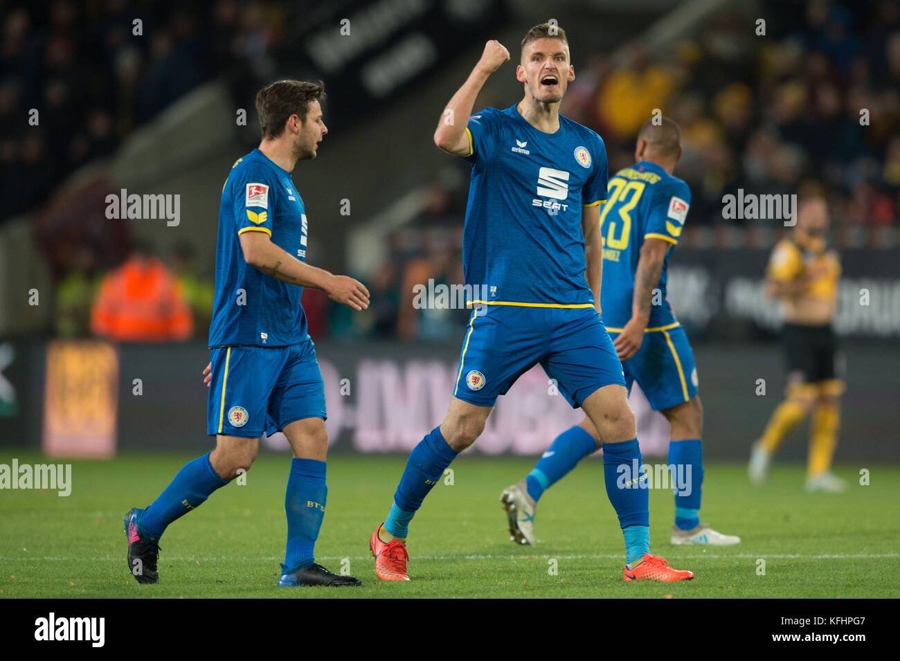 Braunschweig's Gustav Valsvik (C) celebrates his 1-1 goal next to ...