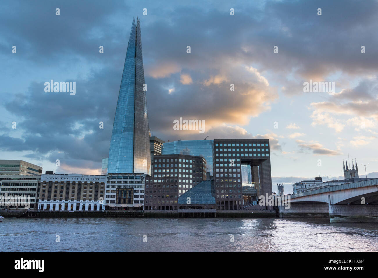 The Shard and One London Bridge at dusk next to London Bridge on the ...