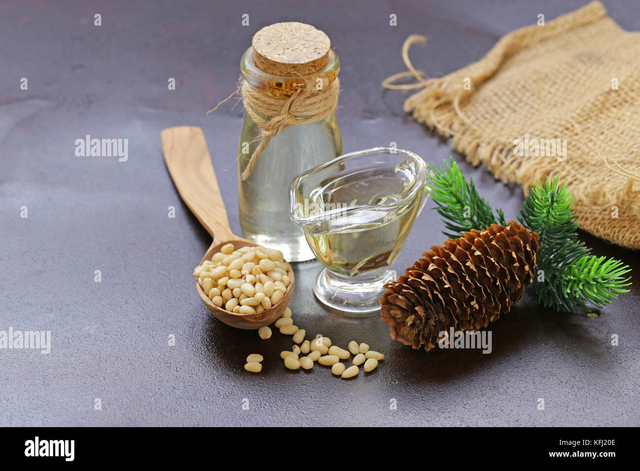 Organic vegetable oil from pine nuts on a table Stock Photo - Alamy