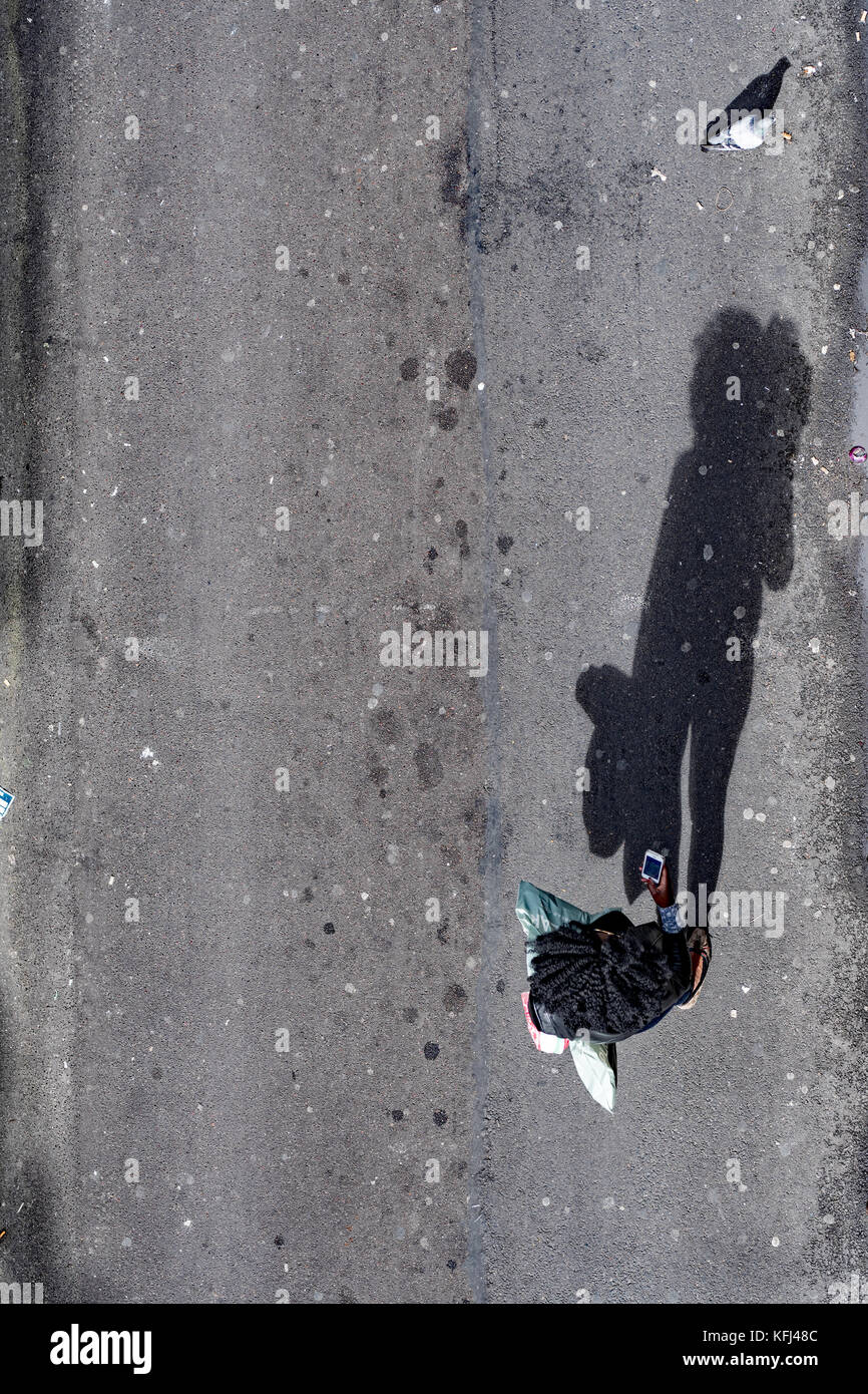 Shadow of a woman walking from above Stock Photo - Alamy