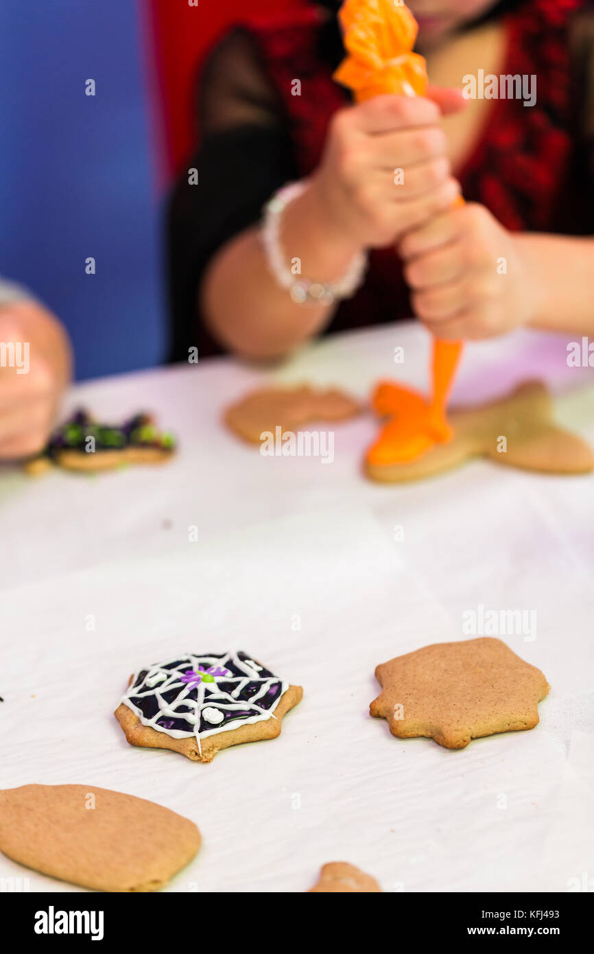 Step by step. Learning how to make and decorate Halloween cookie decorating class Stock Photo ...