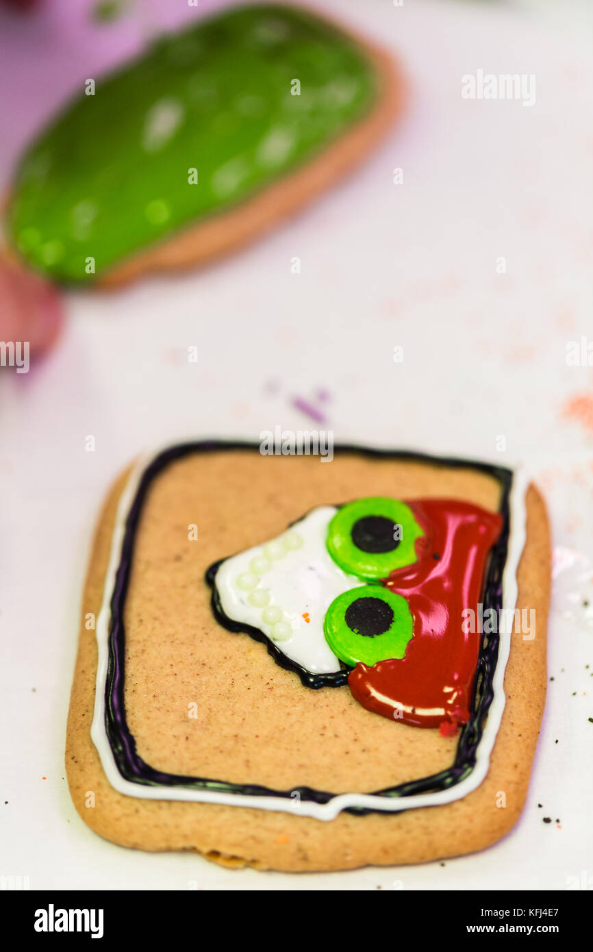 Step by step. Learning how to make and decorate Halloween cookie decorating class Stock Photo ...