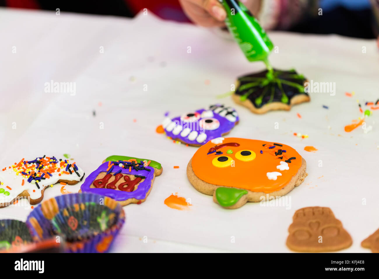 Step by step. Learning how to make and decorate Halloween cookie decorating class Stock Photo ...