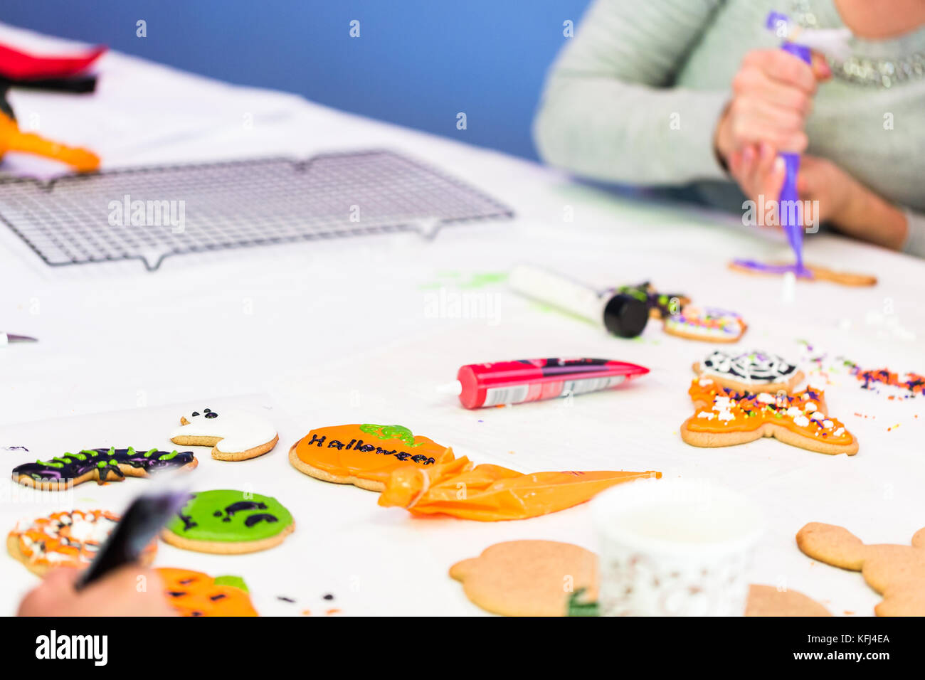 Step by step. Learning how to make and decorate Halloween cookie decorating class Stock Photo ...