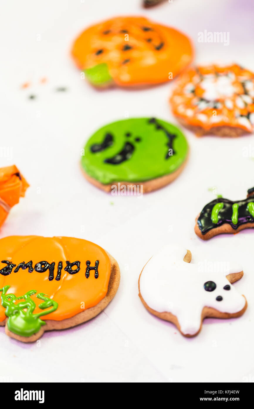 Step by step. Learning how to make and decorate Halloween cookie decorating class Stock Photo ...