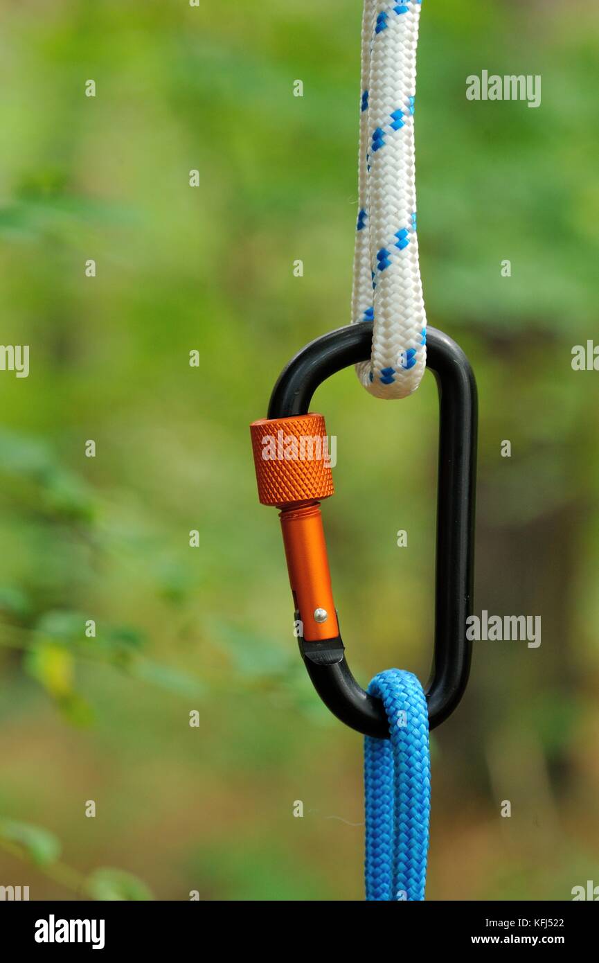 Carabiner with rope on nature background. Climbing uquipment.Climbing ...
