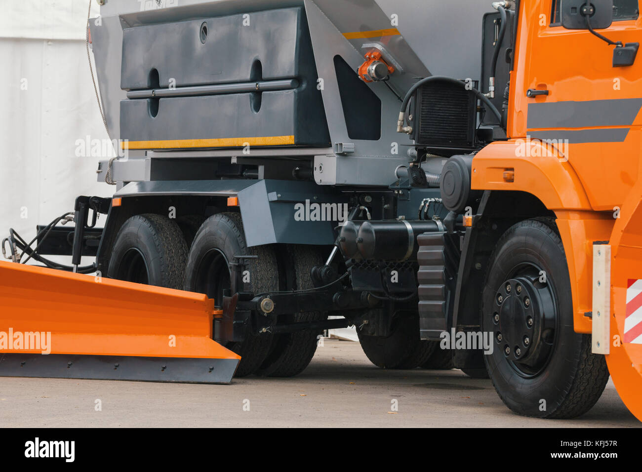 Orange scraper - part of truck constriction vehicle Stock Photo - Alamy