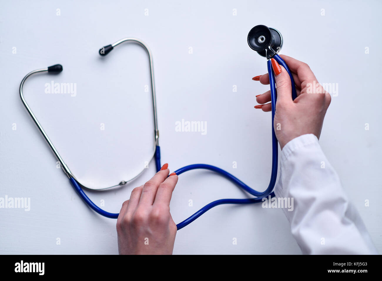A stethoscope in the hands Stock Photo - Alamy