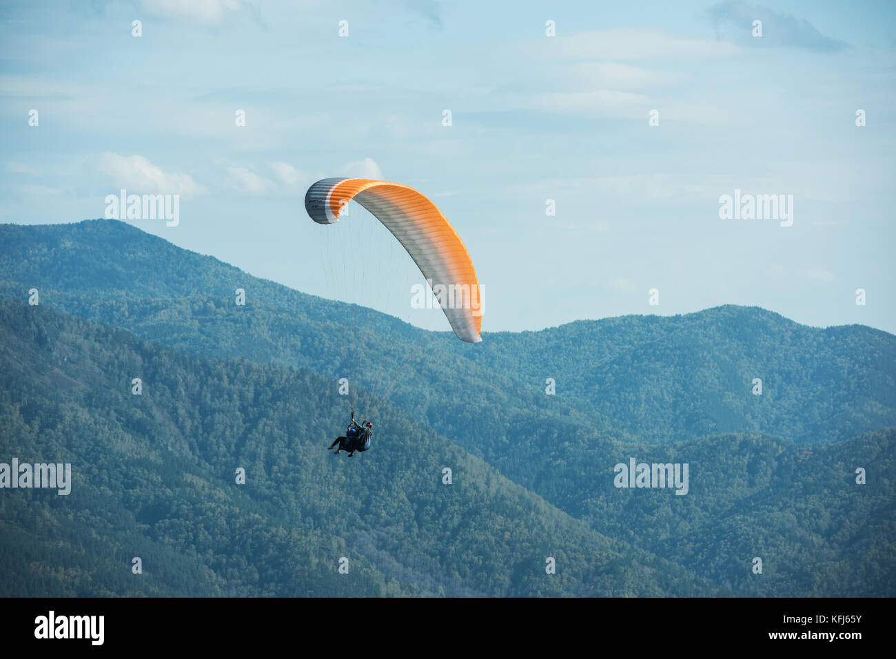 Paragliding in mountains Stock Photo - Alamy