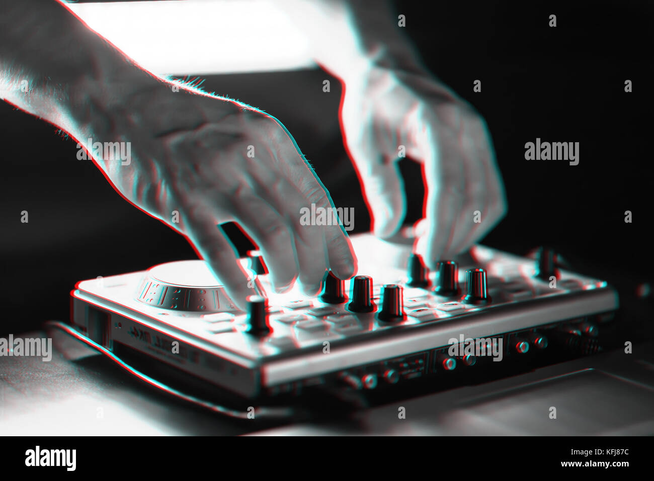 DJ mixer disco illuminated by searchlights Stock Photo - Alamy