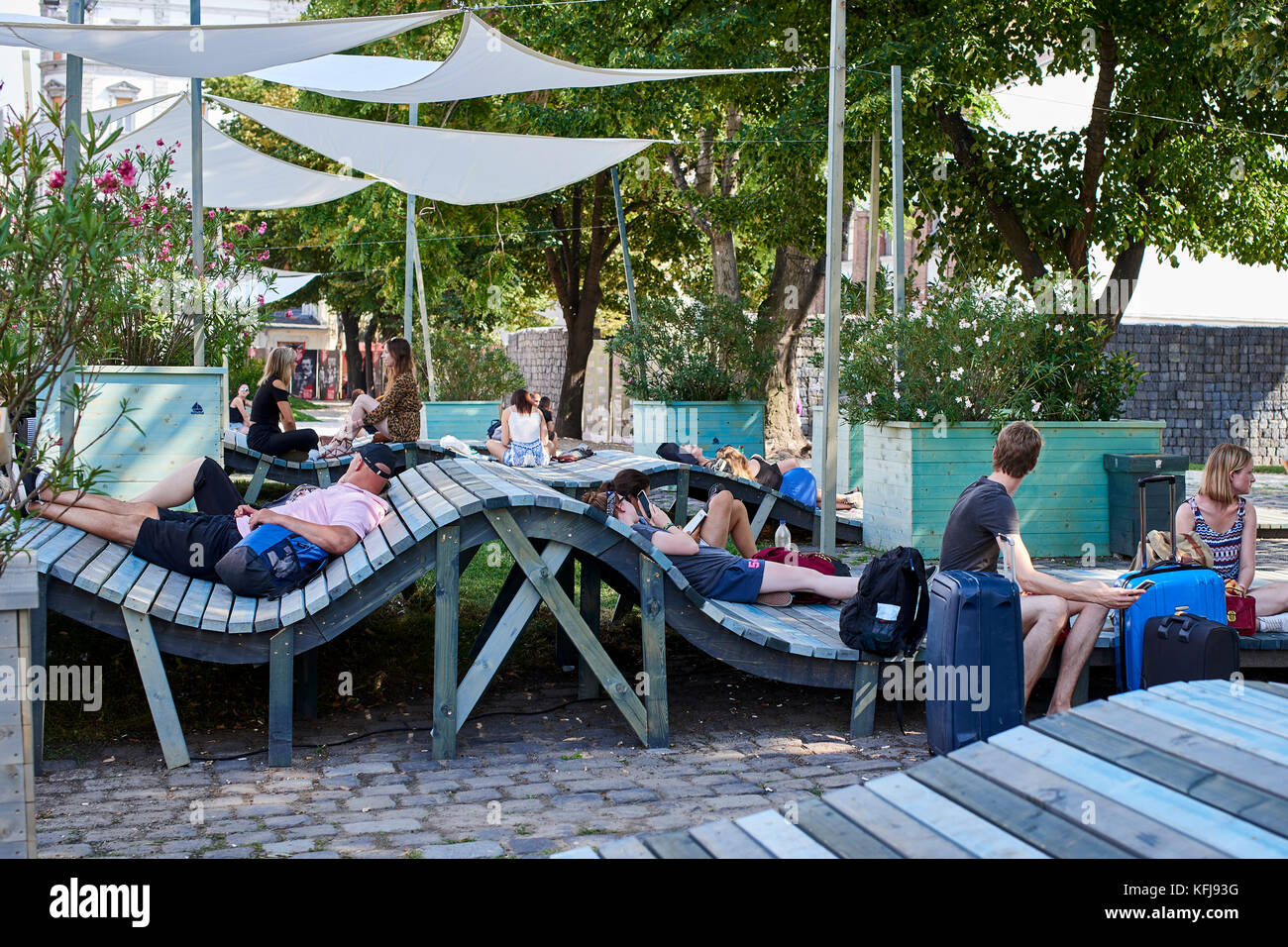 Relaxing on the undulating contemporary benches in the pop-up park ...
