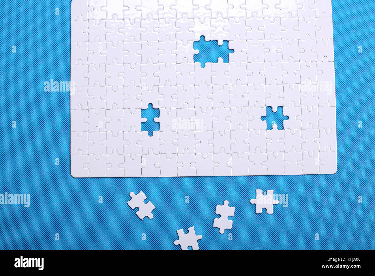White details of a puzzle on a blue background. A puzzle is a pu Stock ...