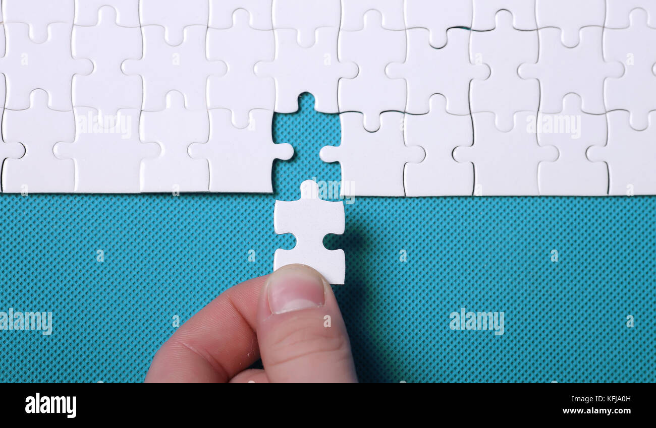 White details of a puzzle on green background. A puzzle is a puz Stock ...