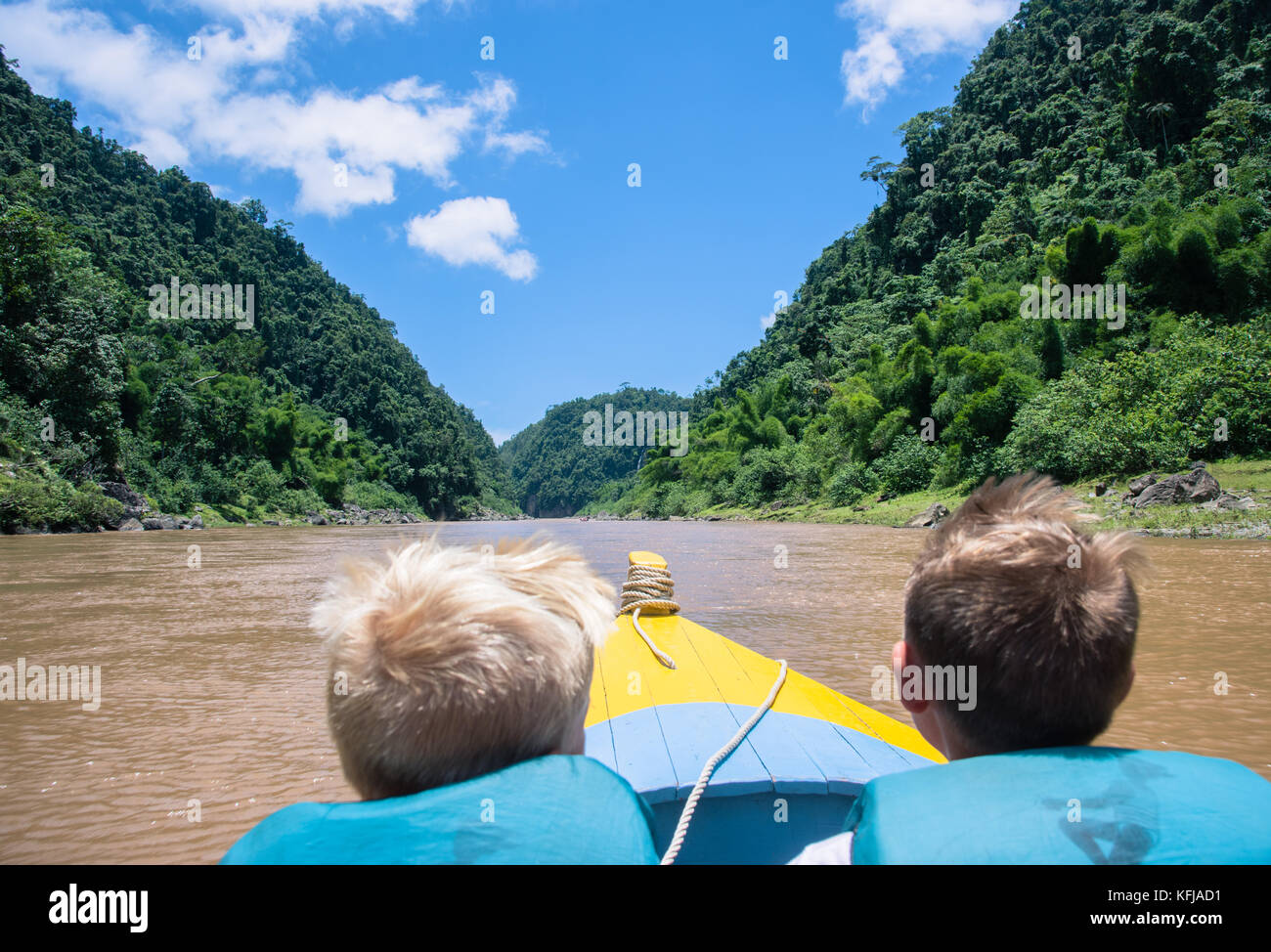 SUVA,VITI LEVU,FIJI-NOVEMBER 28,2016: Tourists traveling in longboat ...