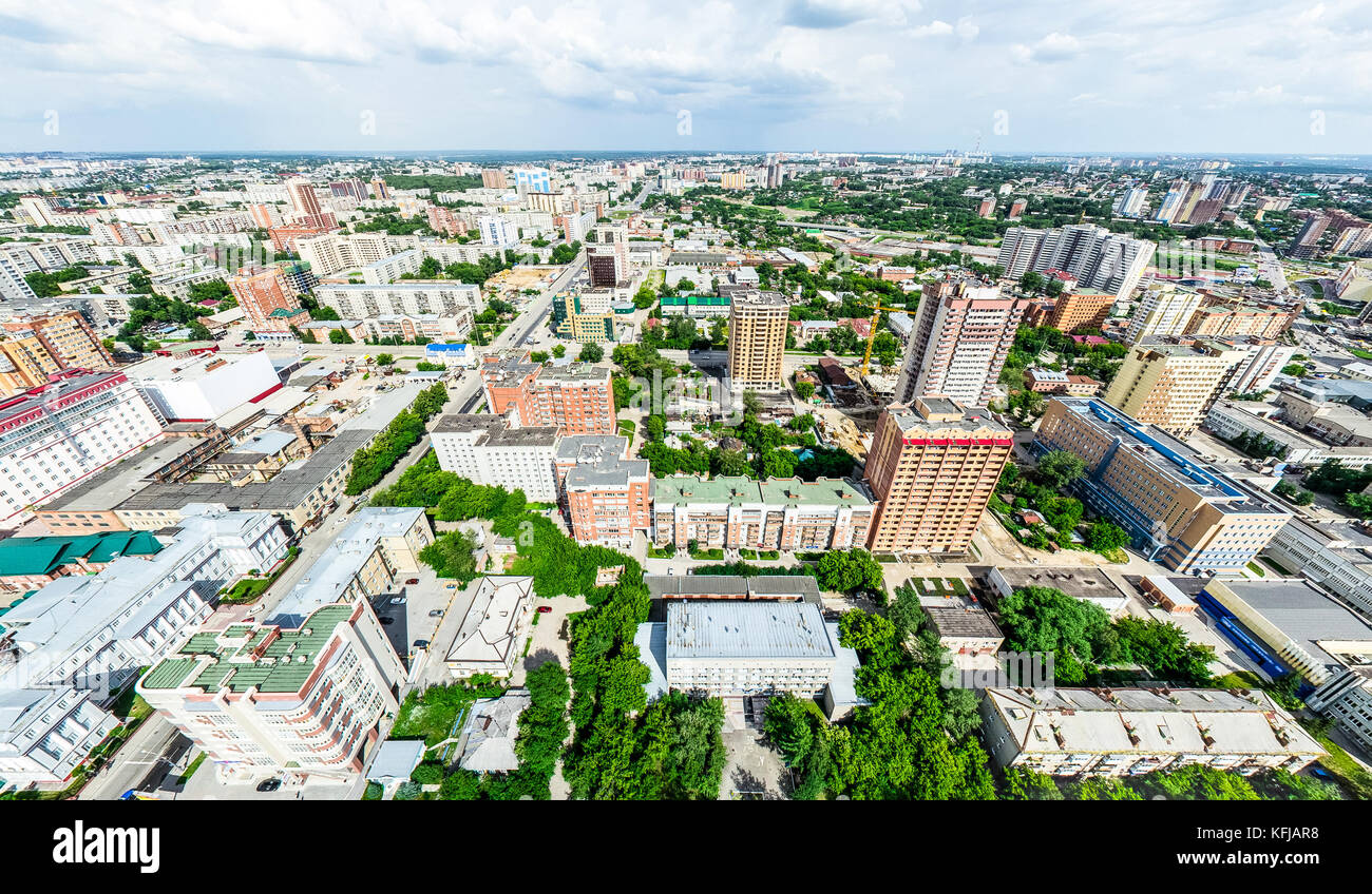 Aerial city view with crossroads and roads, houses, buildings, parks ...