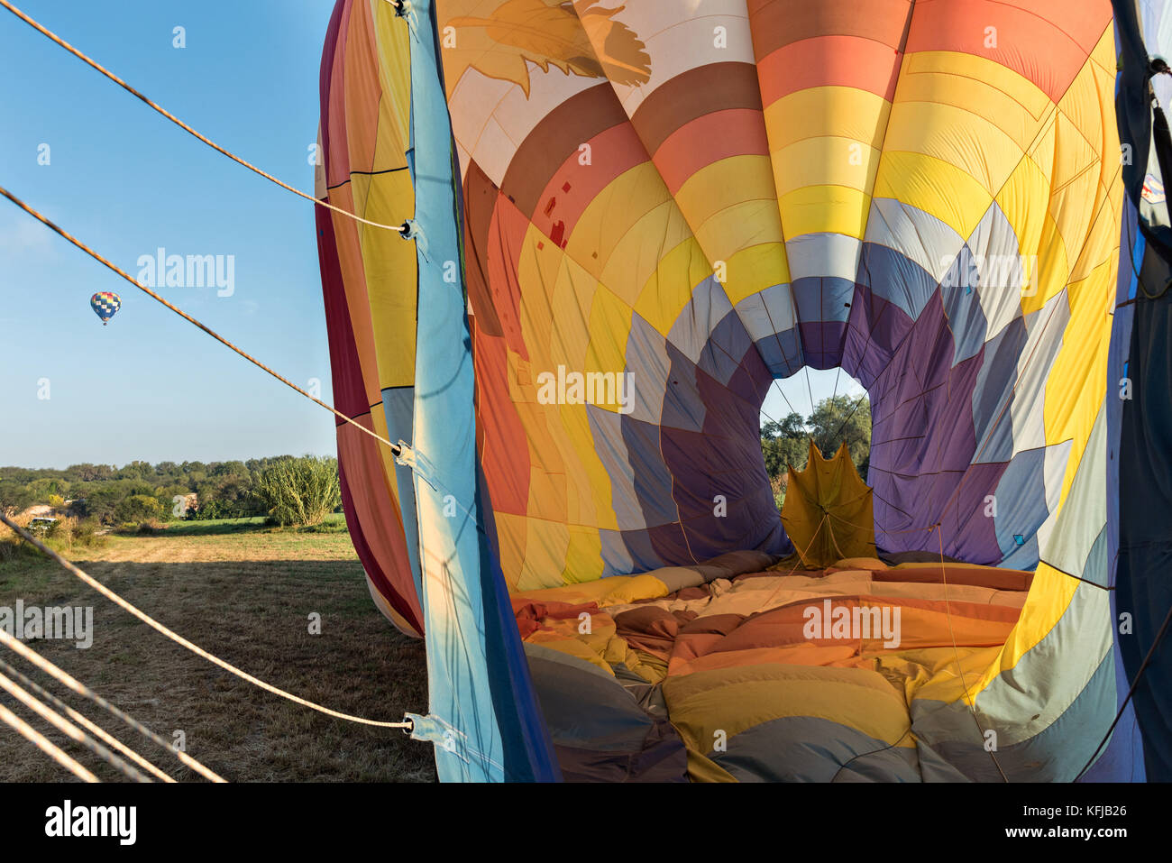 Ground crew begin deflating and securing a hot air balloon after ...