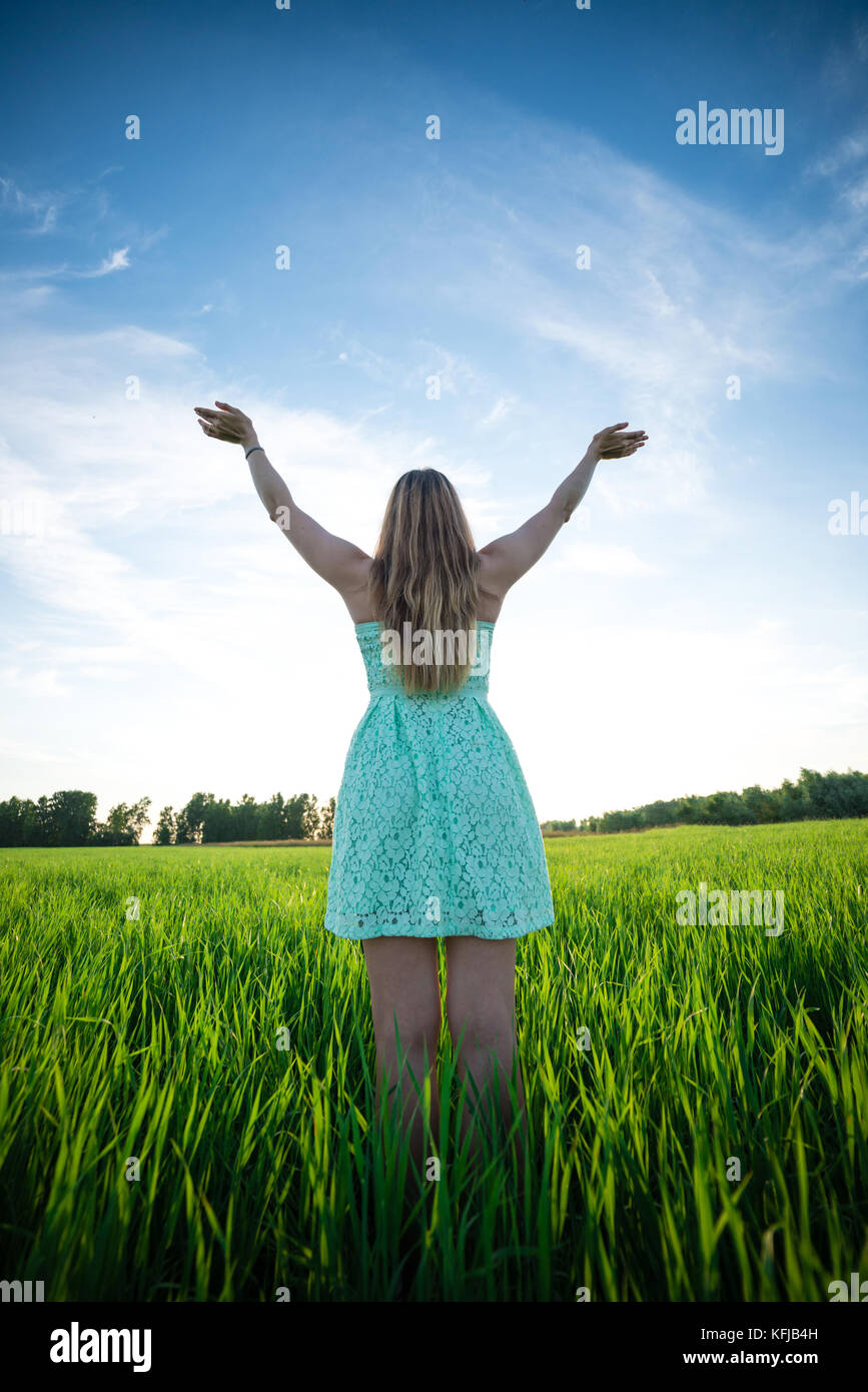 Happiness woman stay outdoor under sunlight of sunset Stock Photo - Alamy