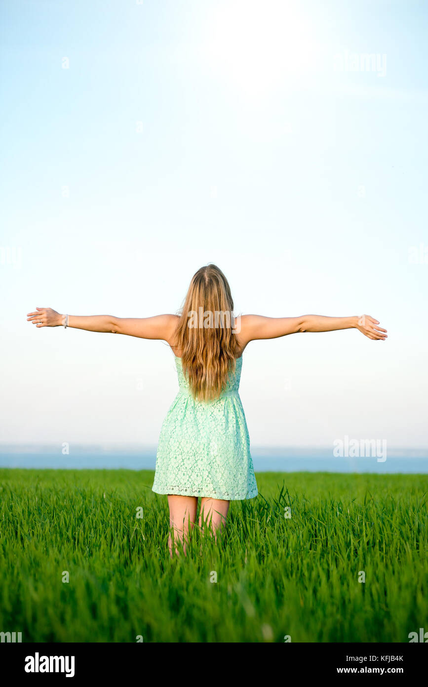 Happiness woman stay outdoor under sunlight of sunset Stock Photo - Alamy
