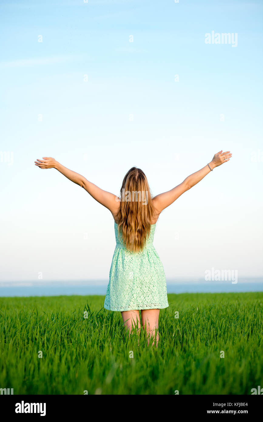 Happiness woman stay outdoor under sunlight of sunset Stock Photo - Alamy
