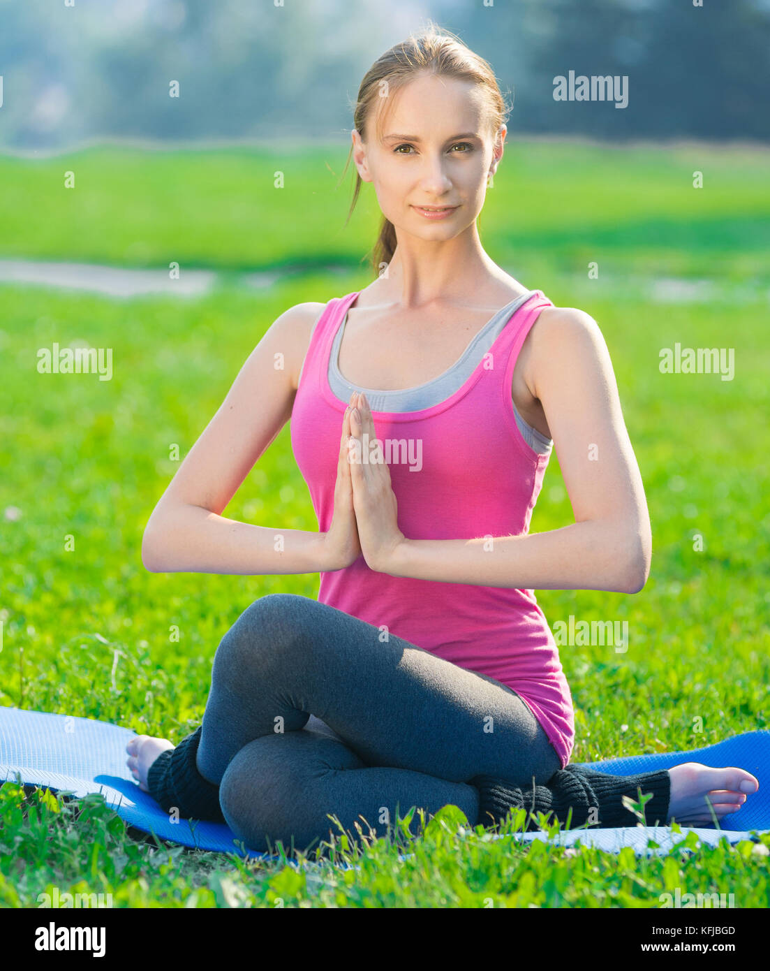 Woman doing stretching fitness exercise. Yoga postures Stock Photo - Alamy