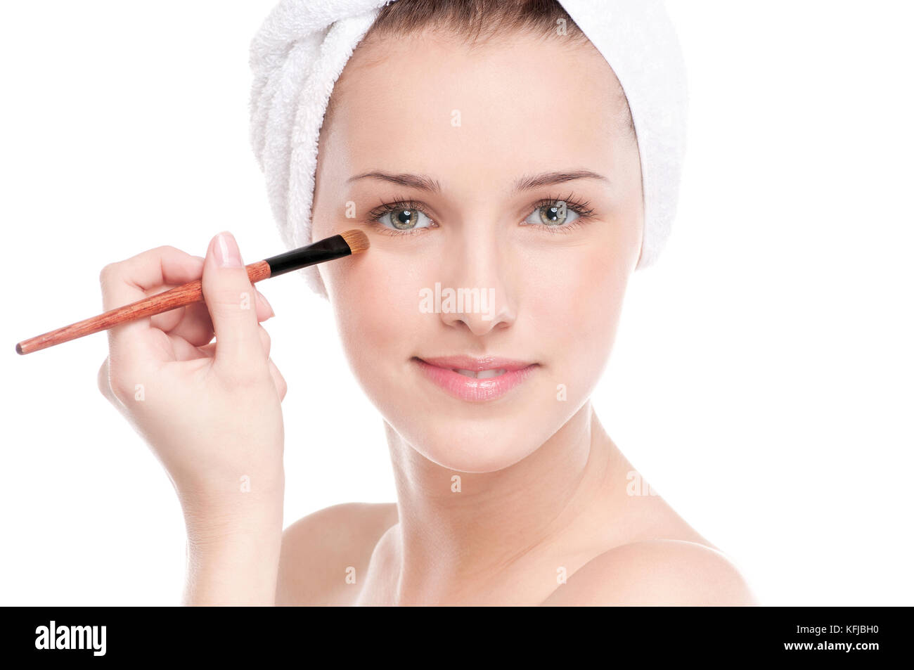 Beautiful woman with make up brush Stock Photo - Alamy