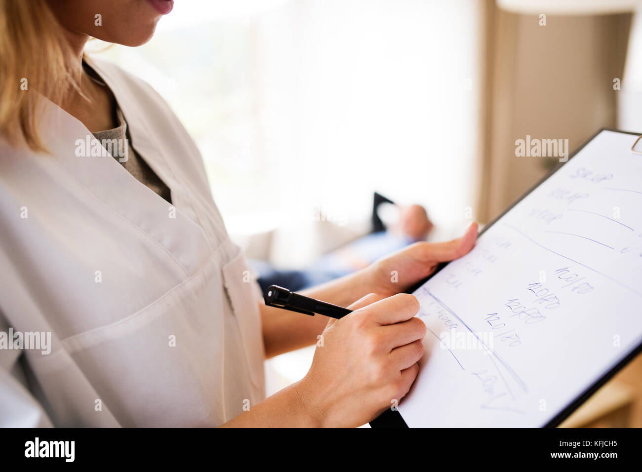 Woman taking notes during home hi-res stock photography and images - Alamy