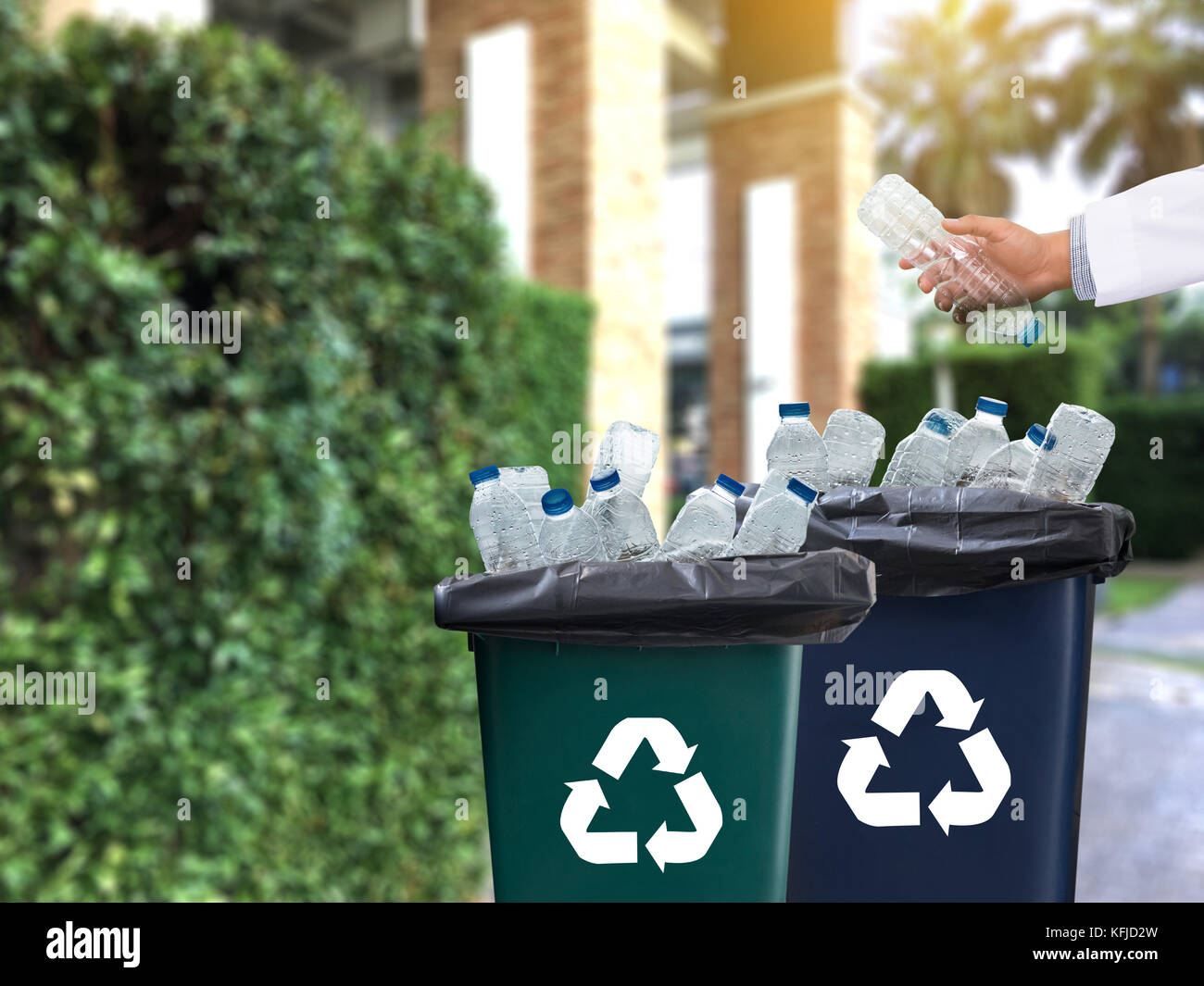 man hand putting plastic reuse for recycling concept environmental ...