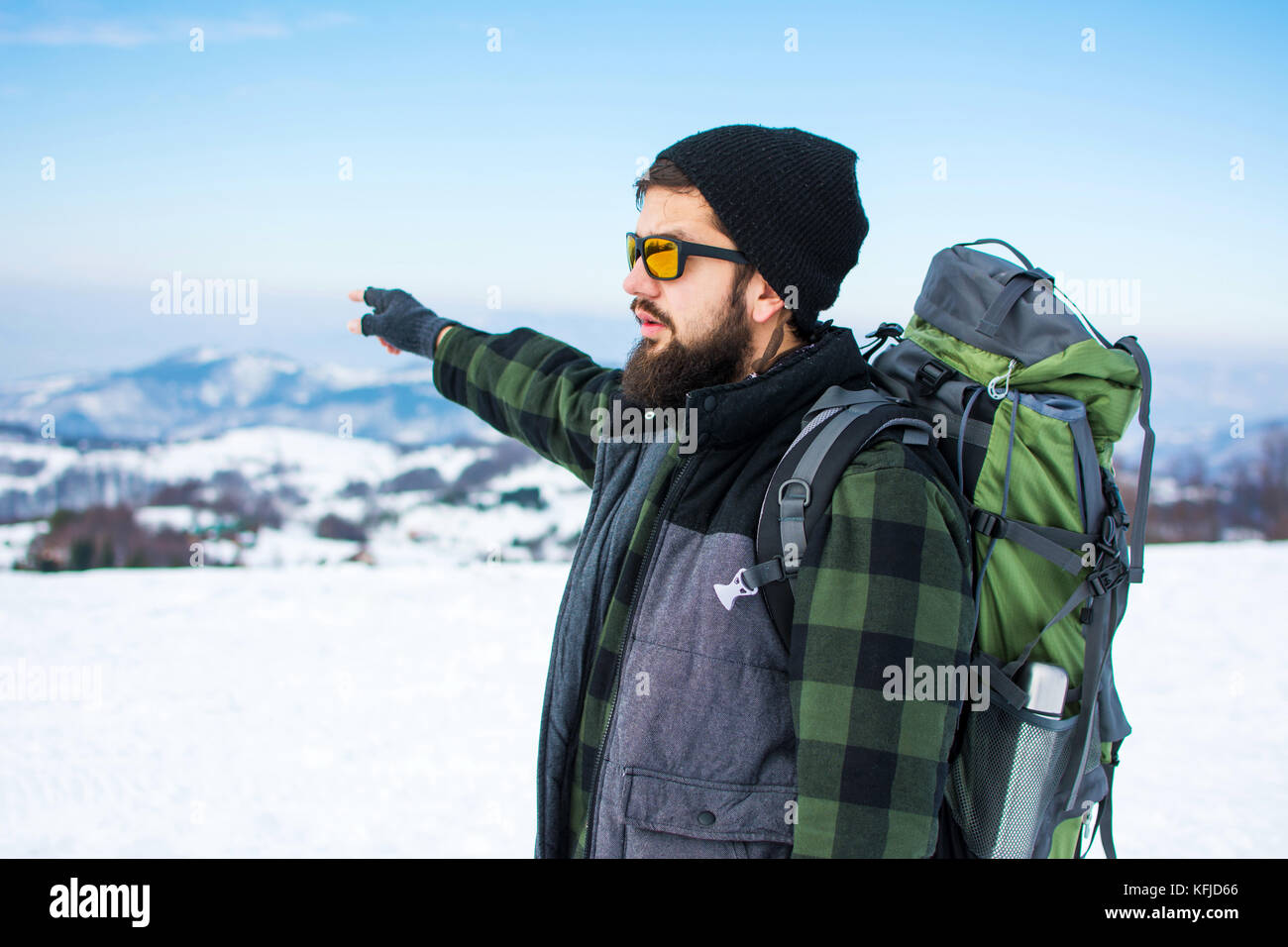Man exploring the snow covered mountain on a hiking trip Stock Photo ...