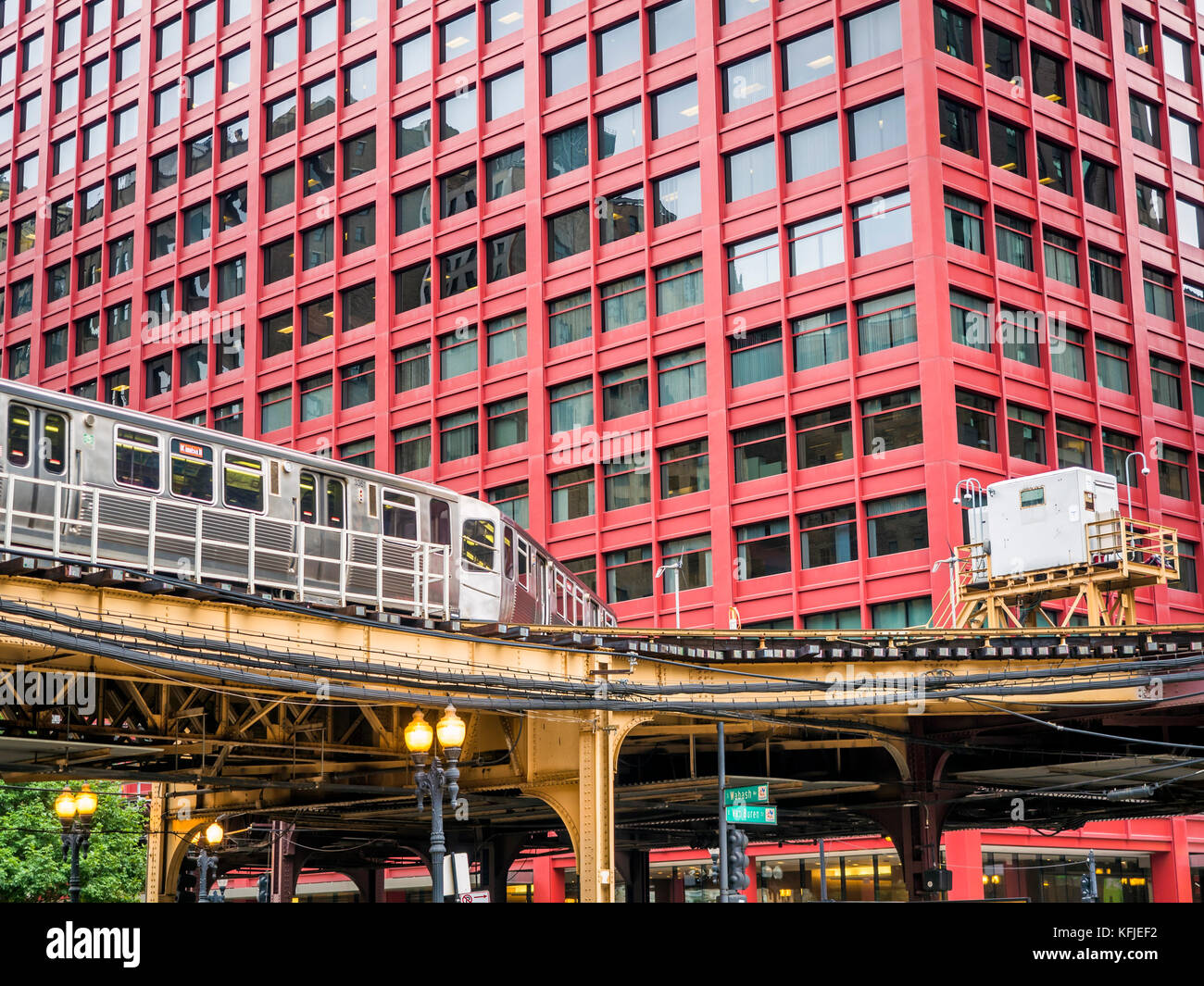Train on elevated tracks within buildings at the Loop, Glass and Steel ...